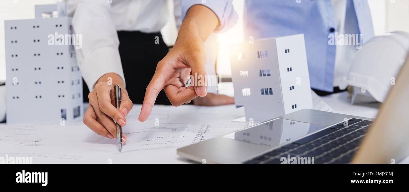 Architect team in office, engineer designers working in Office check ...