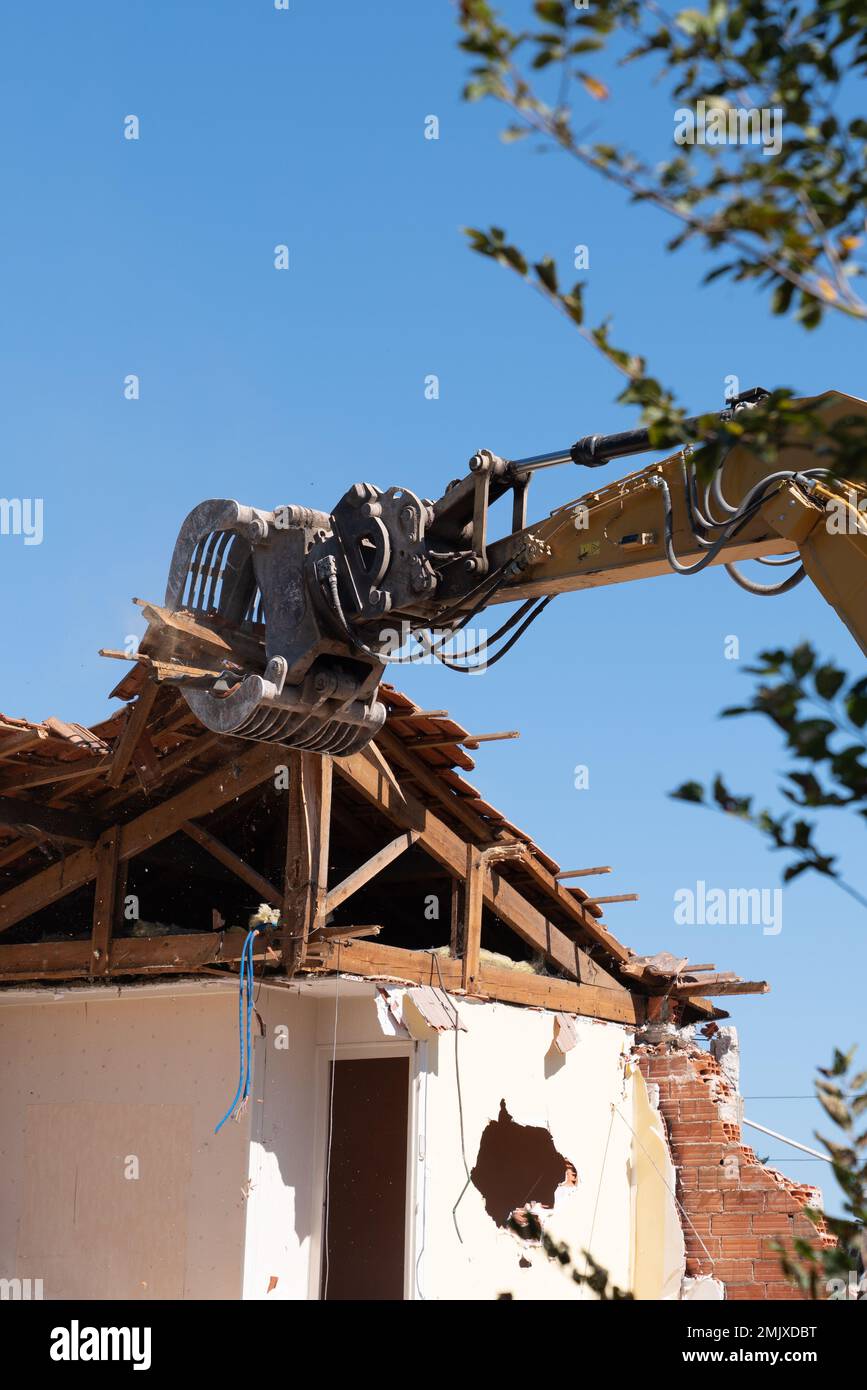 Demolition of house old building using excavator in city Stock Photo ...