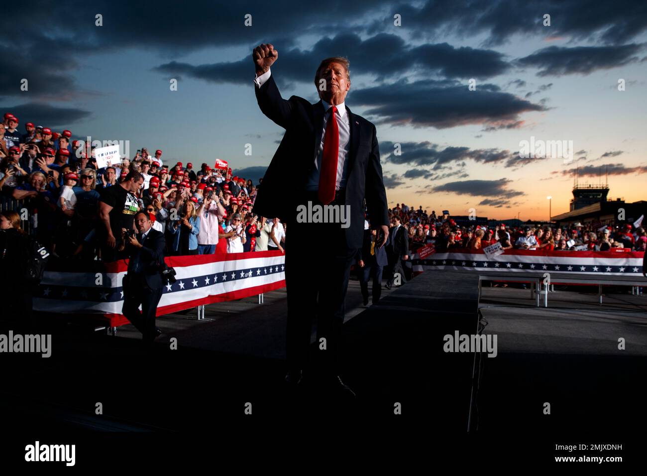 President Donald Trump pumps his fist to the crowd after speaking to a ...