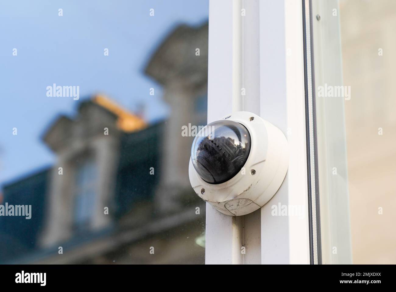 Security CCTV camera on wall in street city center Stock Photo - Alamy