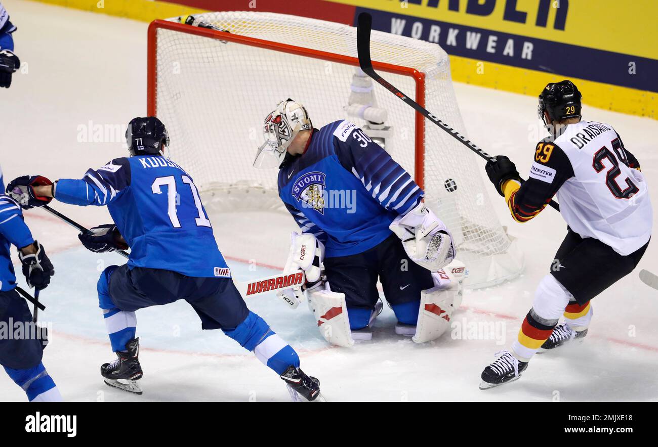 Germany's Leon Draisaitl, right, scores his sides third goal past ...