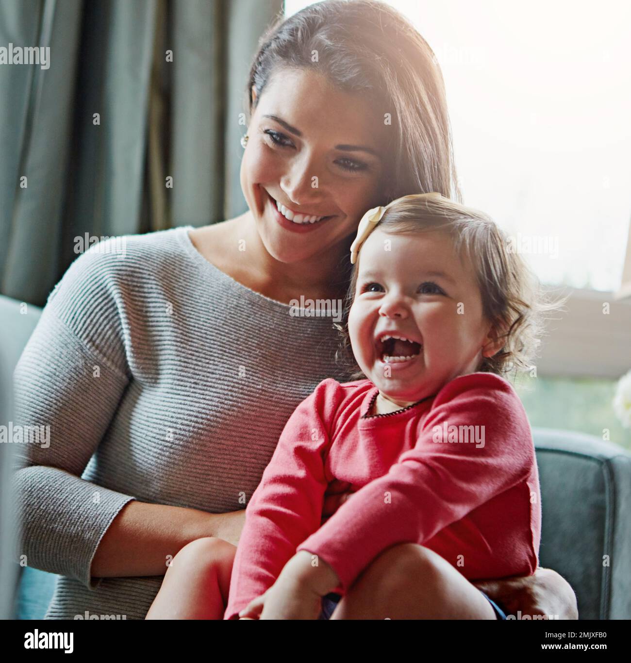 Relax, happy and laughing with mother and baby on sofa for bonding ...