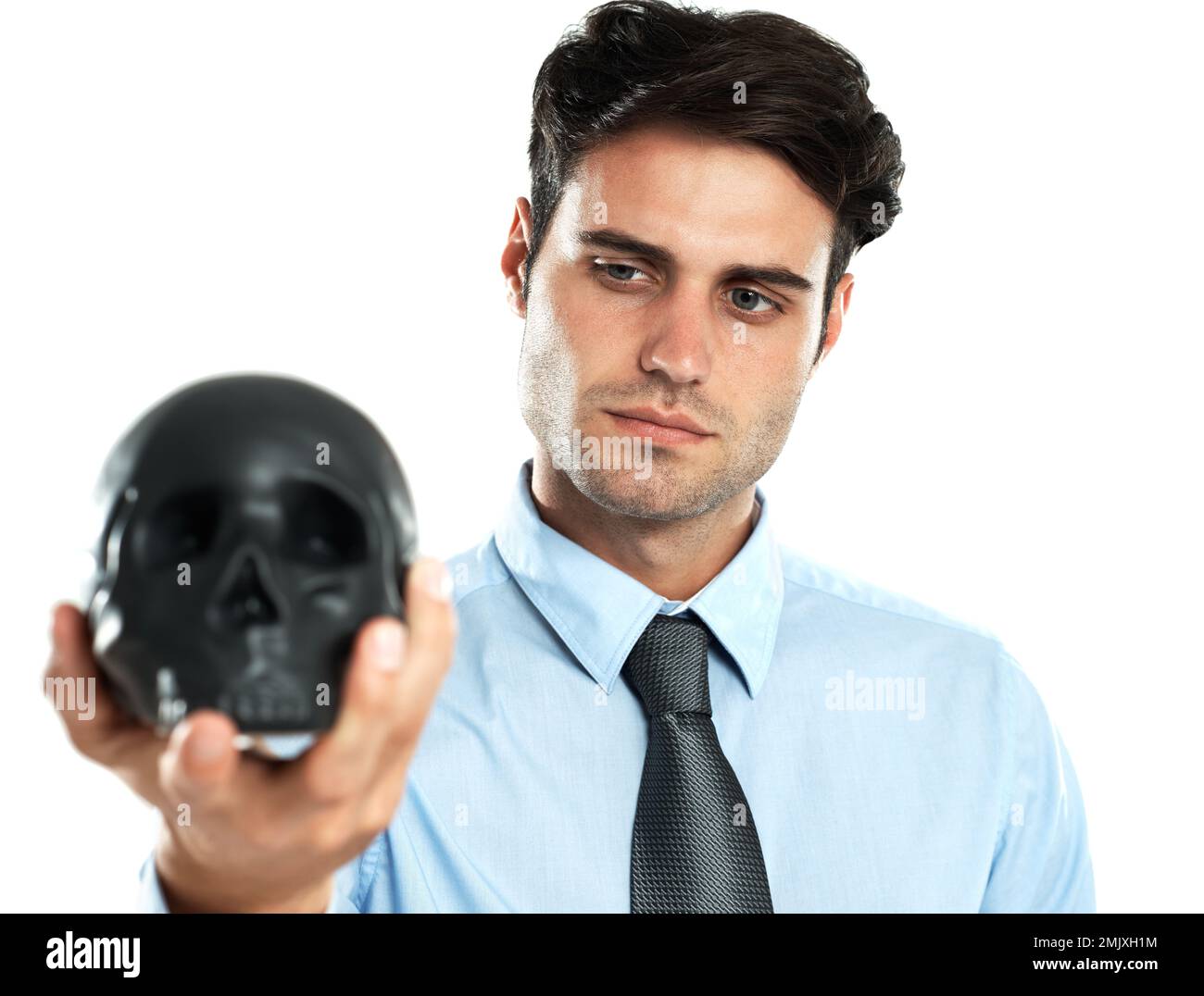 Hand, black and skull by businessman in studio for death, symbol and ...