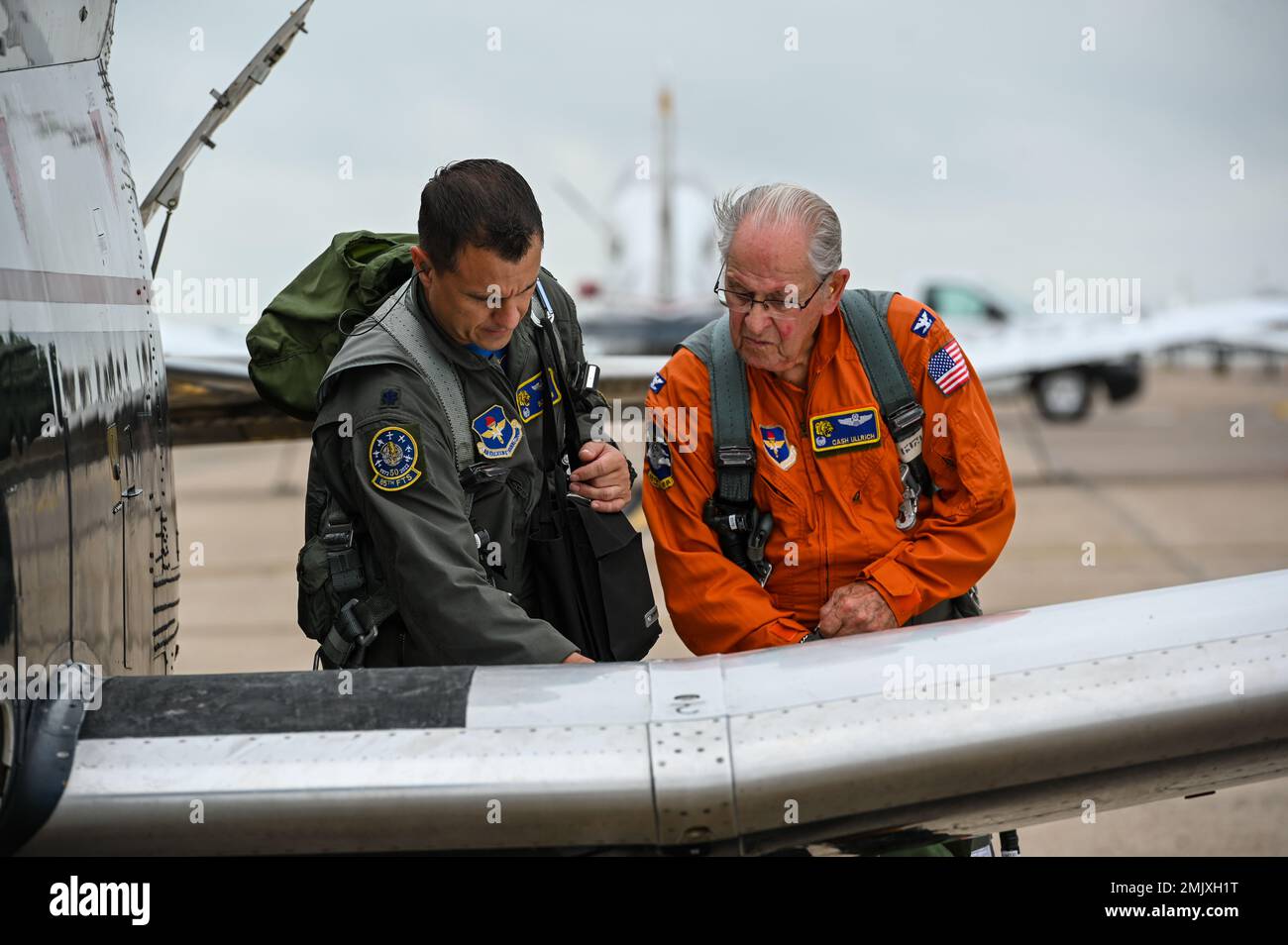 U.S. Air Force Lt. Col. Gregory Show, 85th Flying Training Squadron commander, left, and retired ...