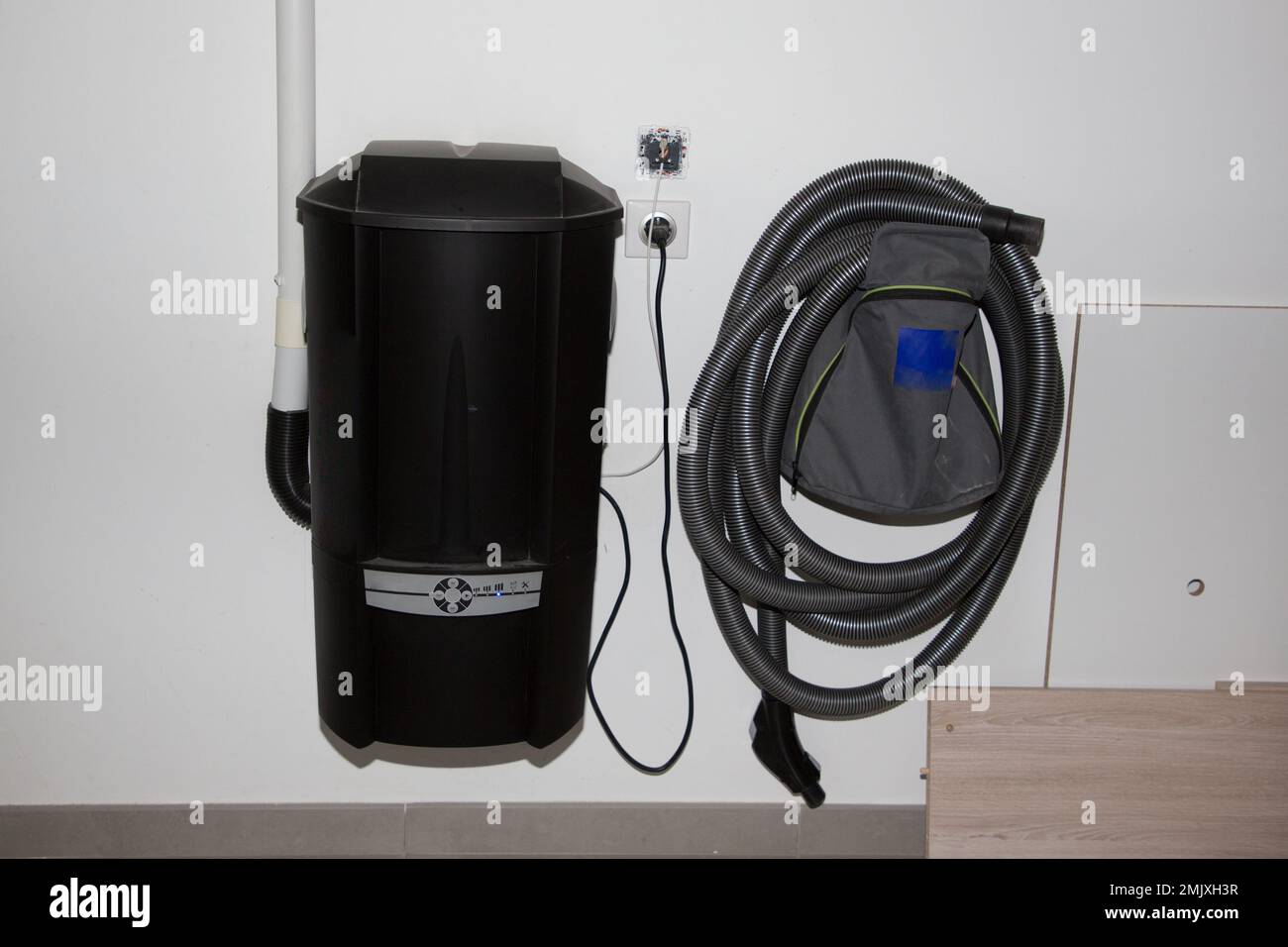 Central vacuum cleaner hose in the basement of the house Stock Photo ...