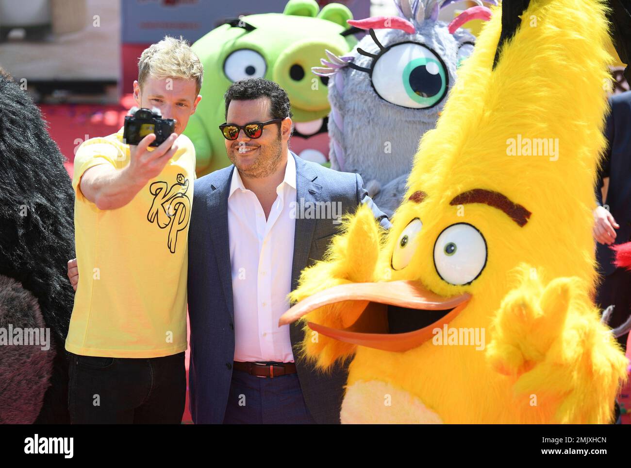 Actors Enzo Knol, left, and Josh Gad poses for photographers during a ...
