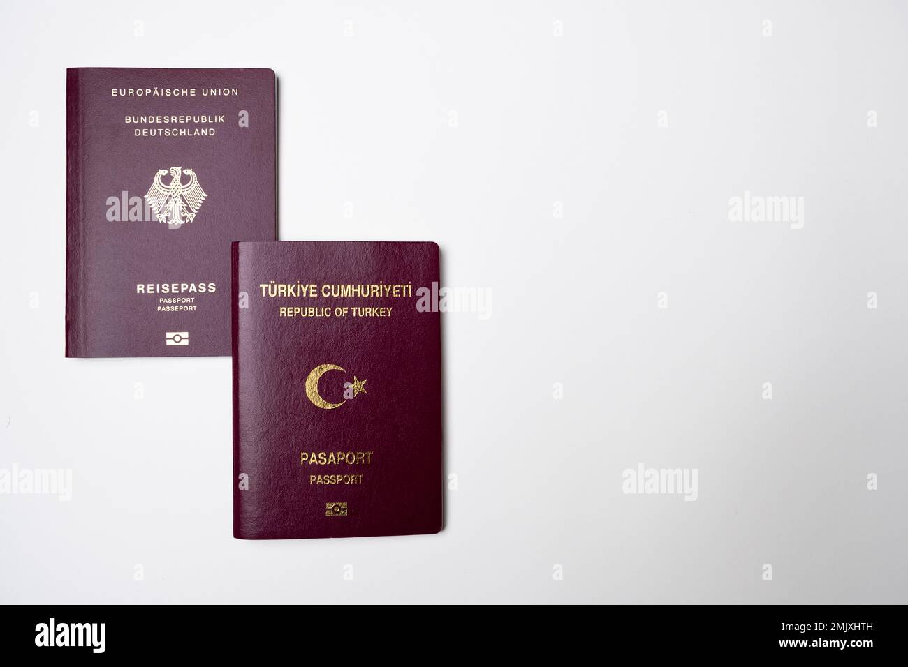 Gronau, Germany, 01.12.2023, Turkish and German passports on a white ...