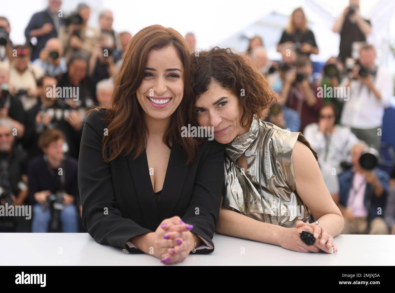 Actresses Nisrin Erradi, left, and Lubna Azabal pose for photographers ...