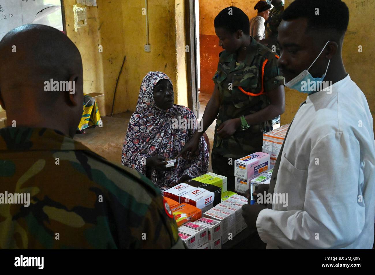 Ghanaian soldiers from the 6th Infantry Battalion give prescribed ...