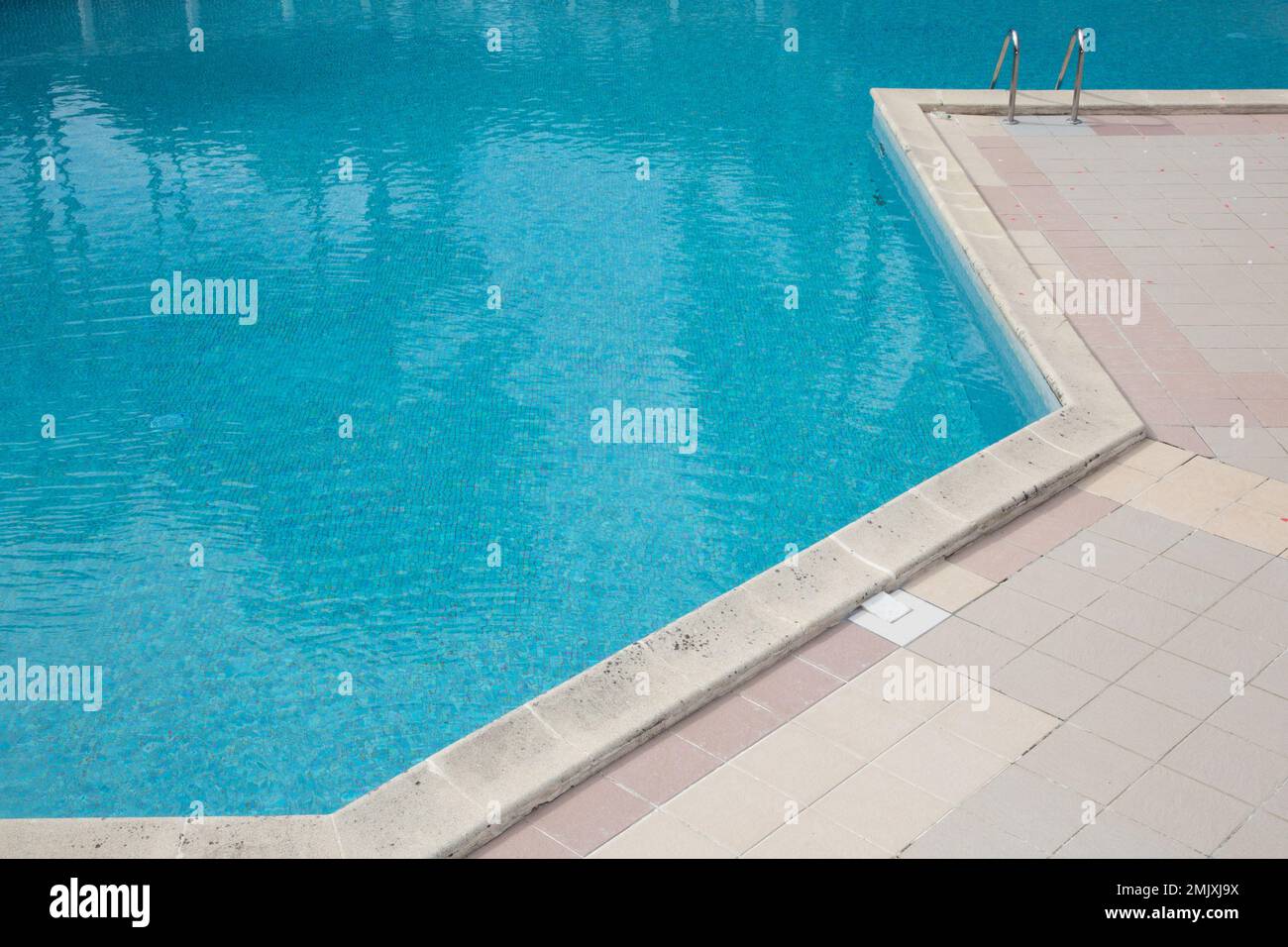 corner swimming pool detail with clear blue water Stock Photo - Alamy