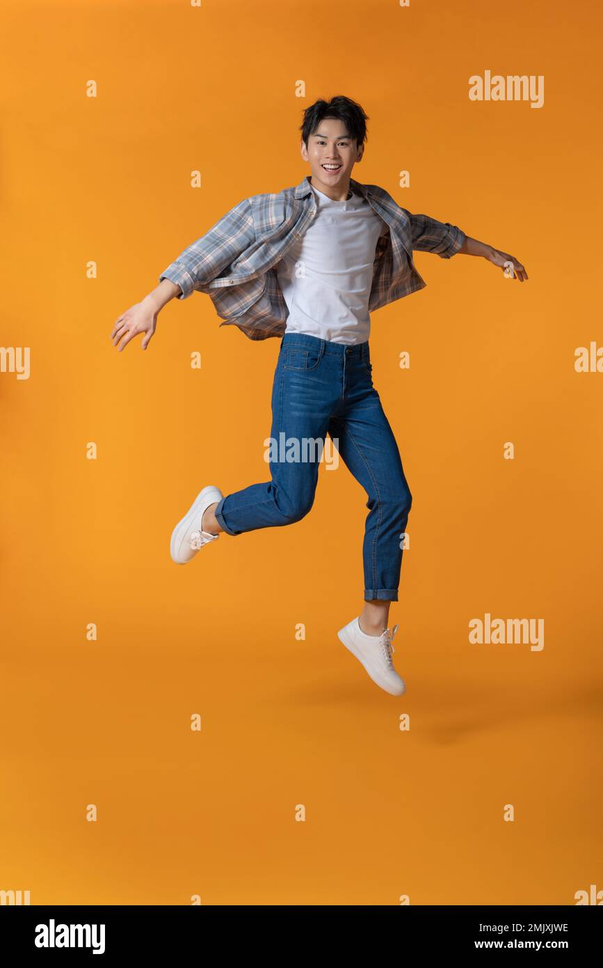 Young men jump Stock Photo - Alamy