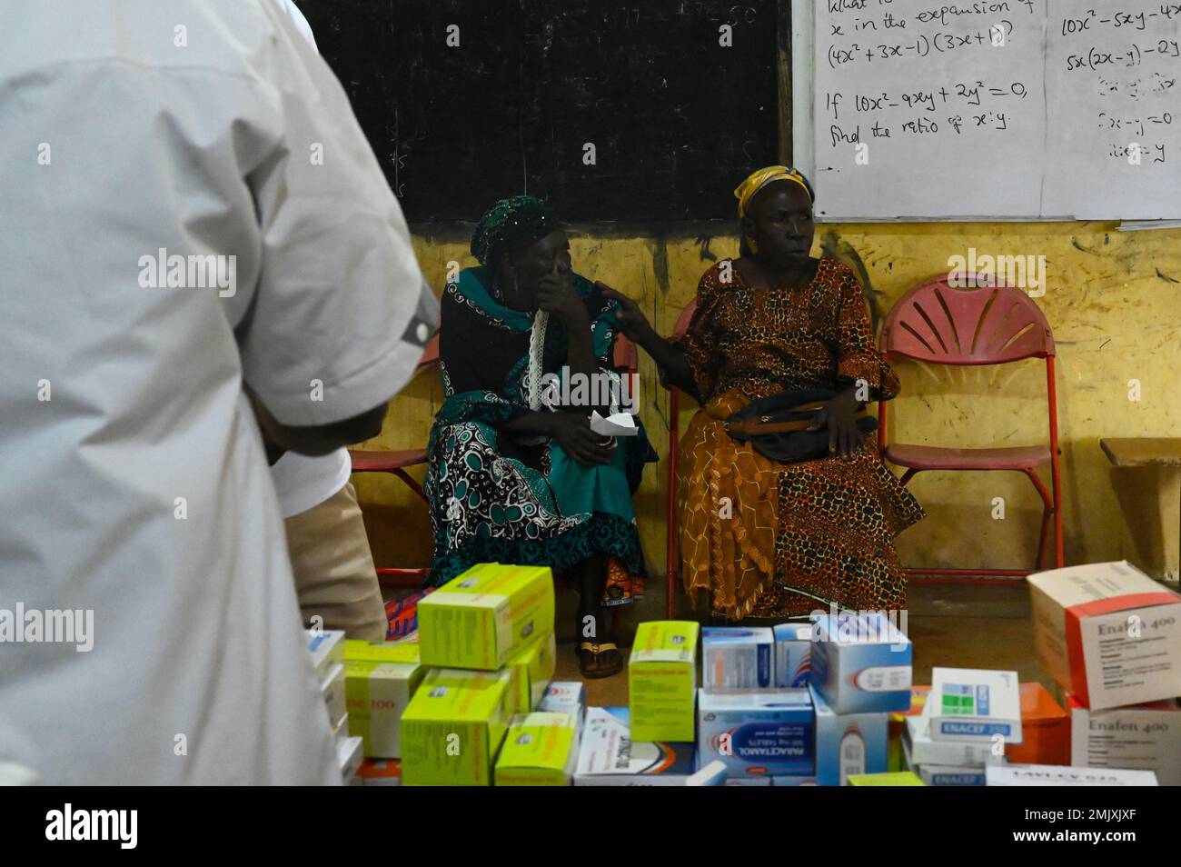 Ghanaian medical professionals screen, treat, and give medication to an ...