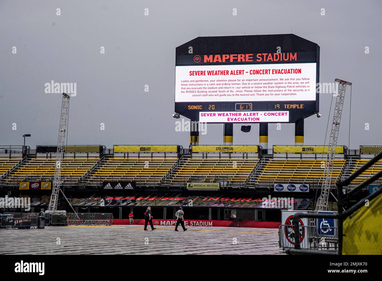 A severe weather alert is posted on the Mapfre Statium score board at ...