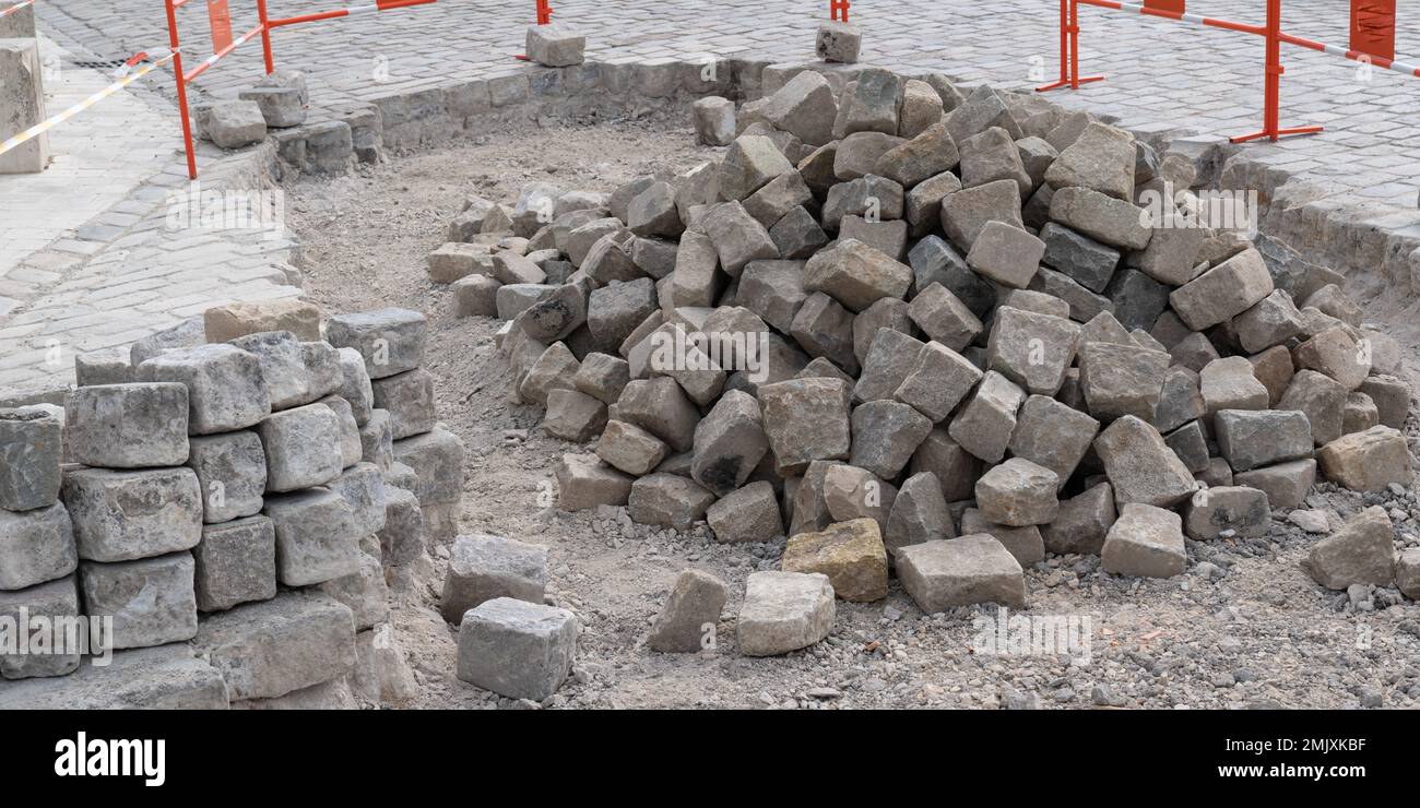pile of processed pieces of granite prepared for work on paving ...