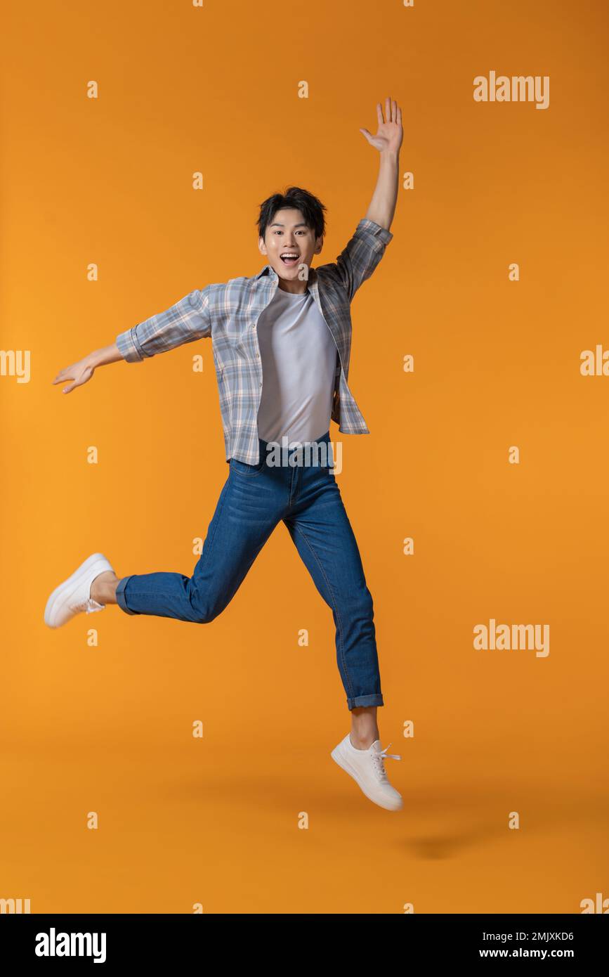Young men jump Stock Photo - Alamy