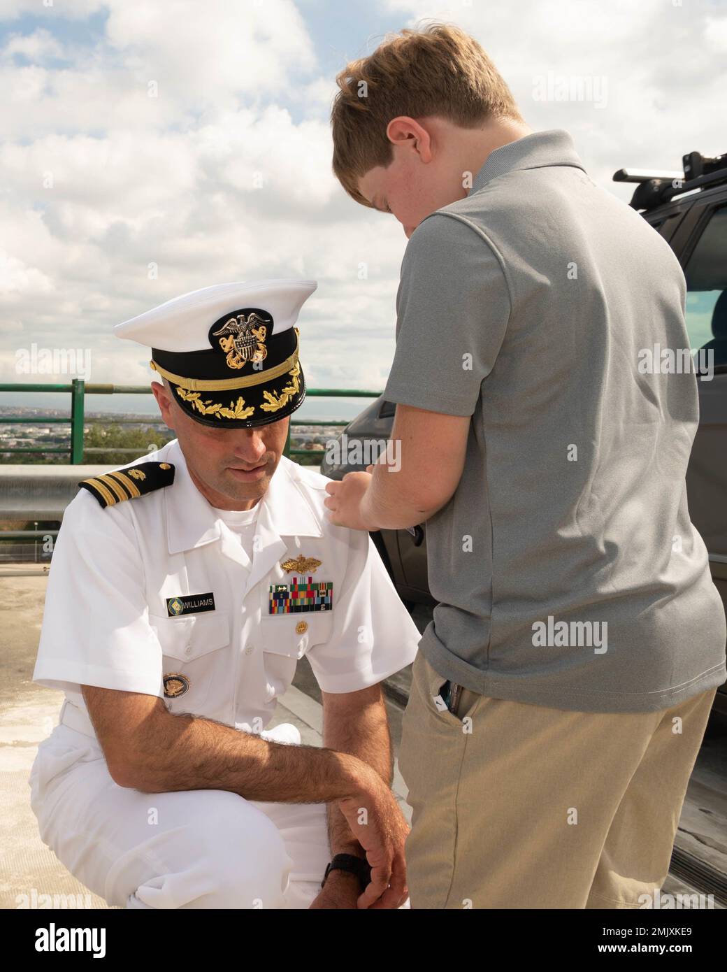 Capt. Matthew Williams has his commander shoulder boards removed by his ...