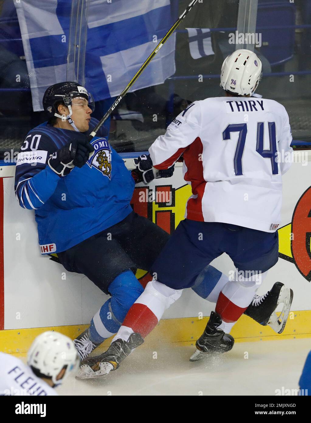 Thomas Thiry of France, right, checks Finland's Miika Koivisto, left ...