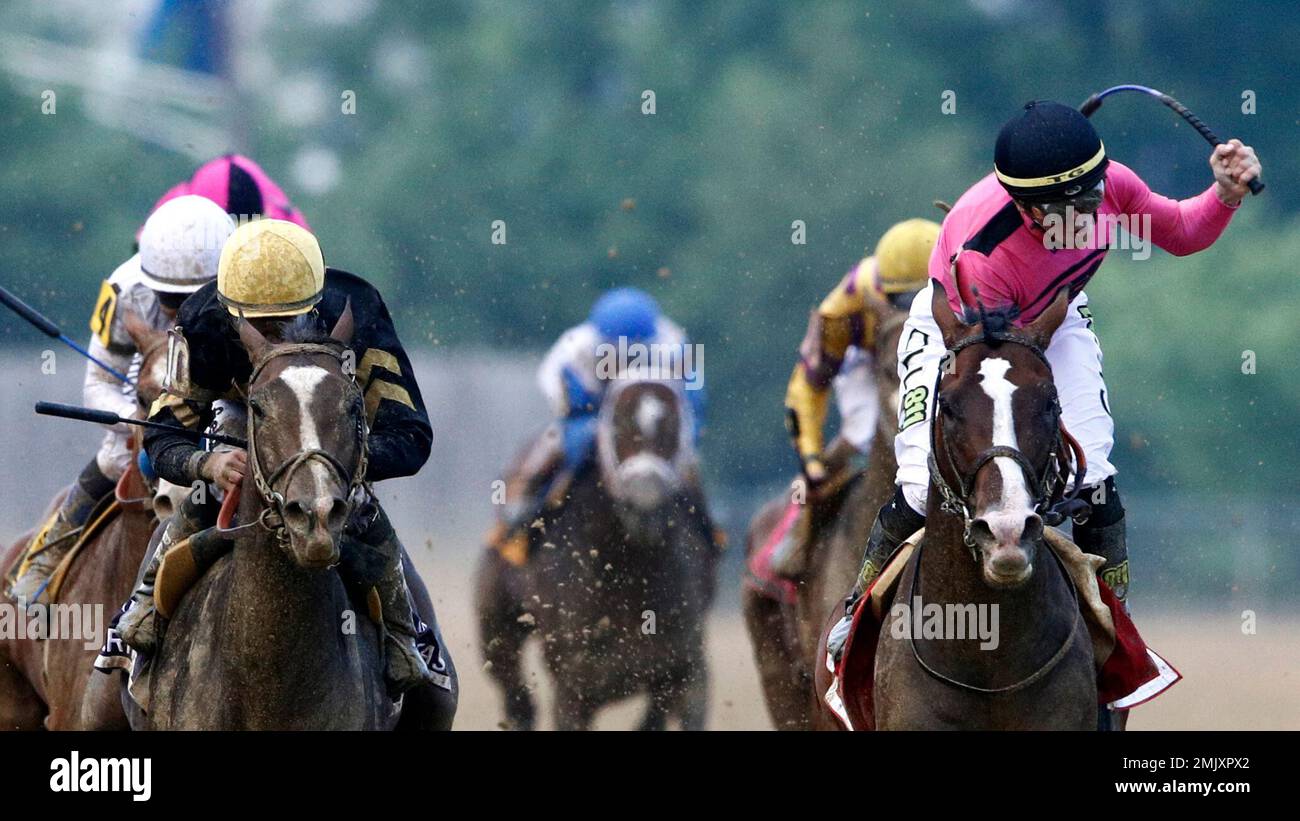 War of Will, ridden by Tyler Gaffalione, right, reacts after crossing ...