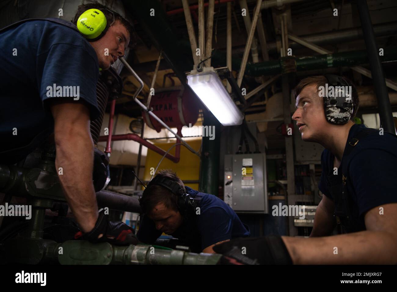 From left, U.S. Coast Guard Petty Officer 3rd Class Logan Henderson ...