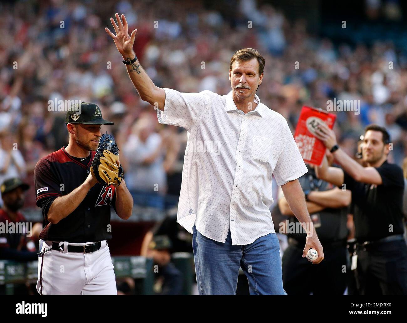 Arizona Diamondbacks Hall of Fame pitcher Randy Johnson, center, next ...