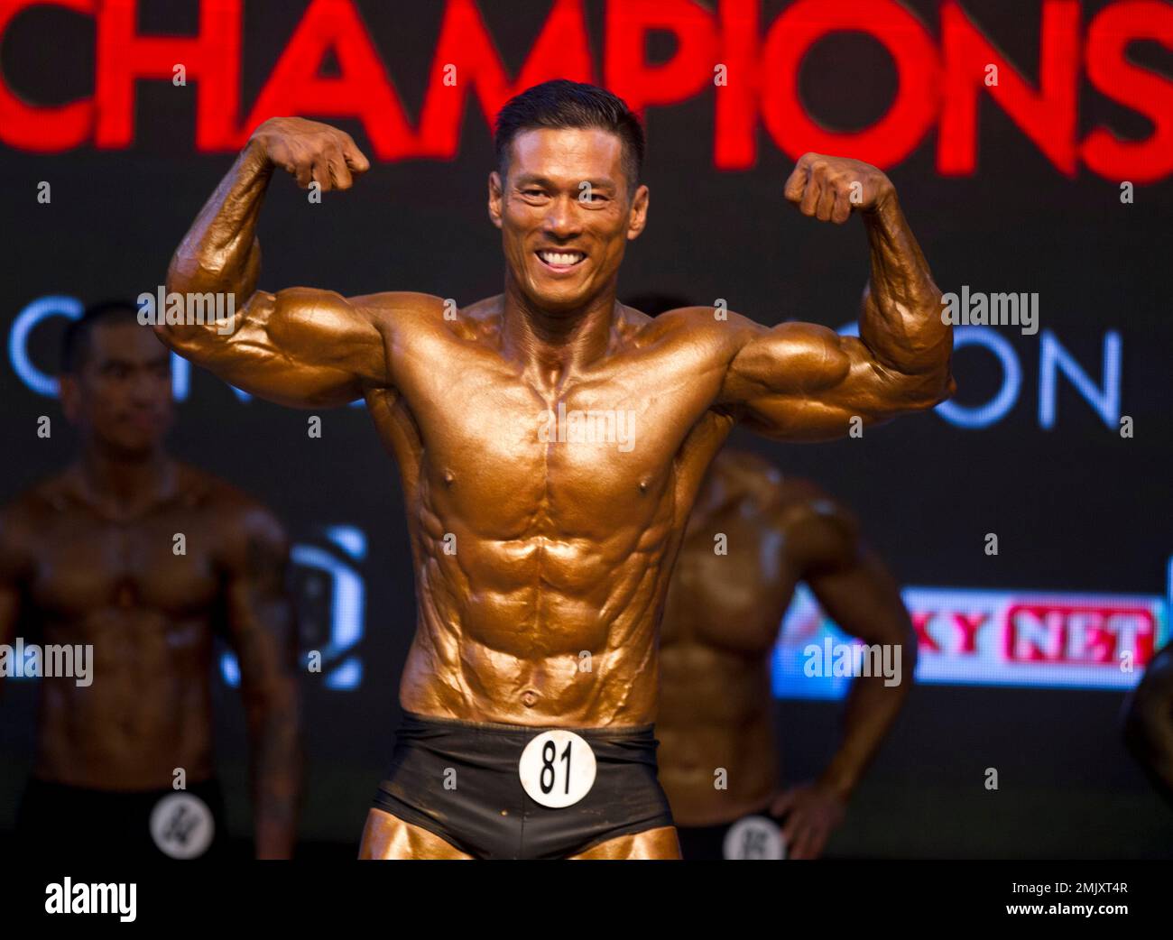 Vietnam's Huynh Trong Huu competes in the Men's Athletic Physique 167cm ...