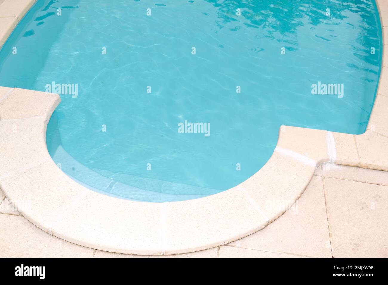 Blue steps stairway into swimming pool Stock Photo - Alamy