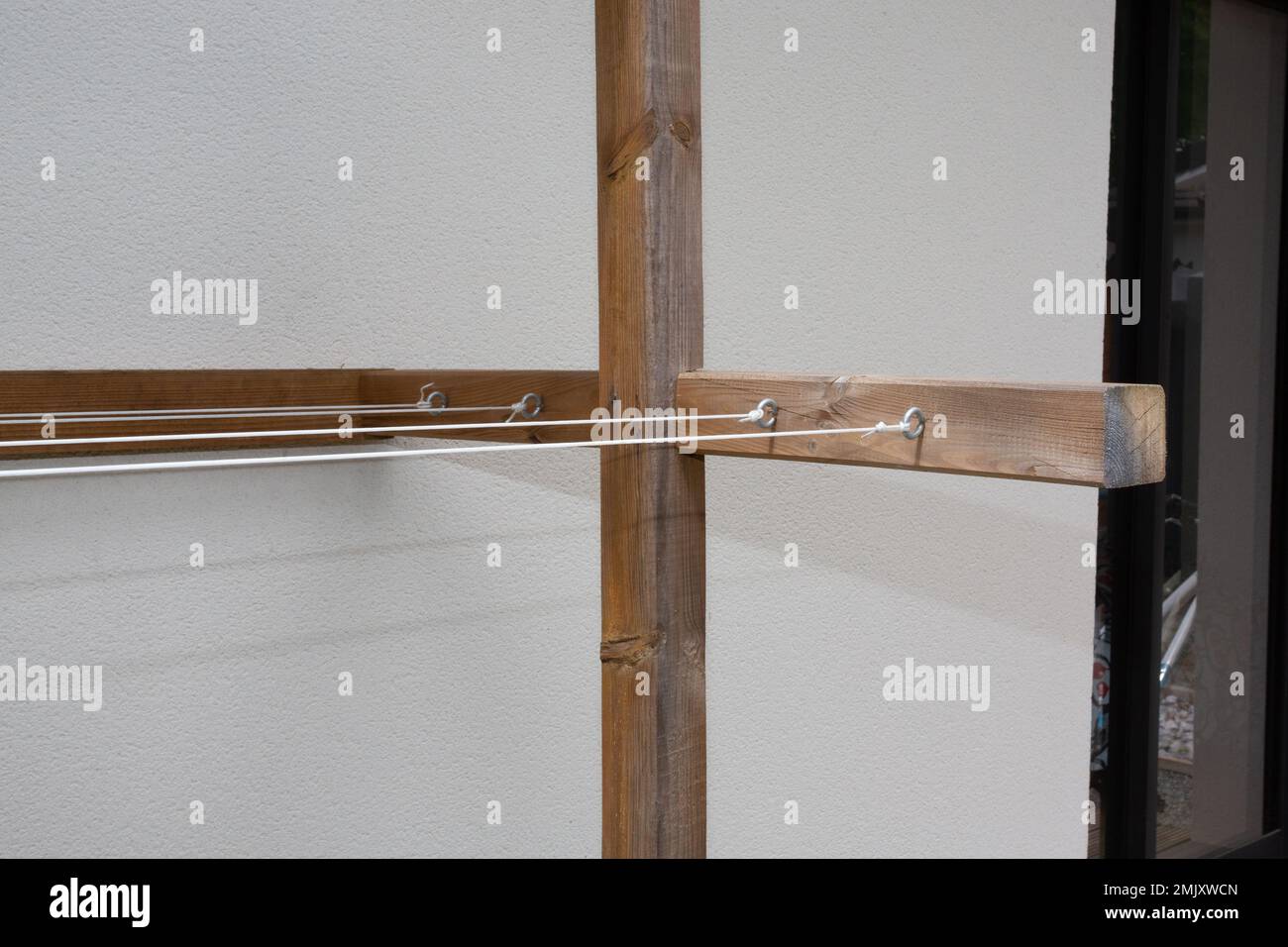 wooden tied clothes line in home garden Stock Photo - Alamy