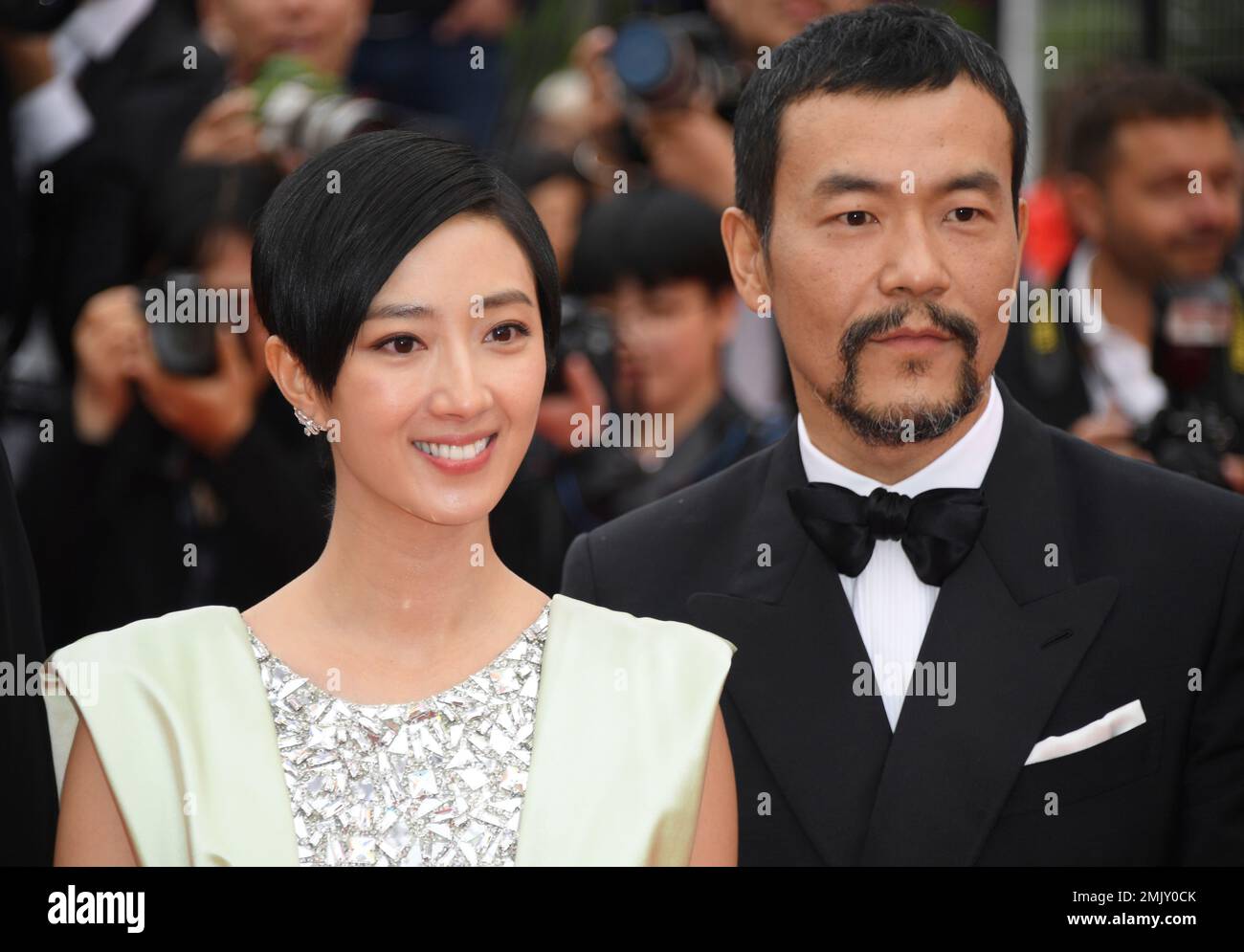 Actors Kwai Lun-Mei, left, and Liao Fan pose for photographers upon ...
