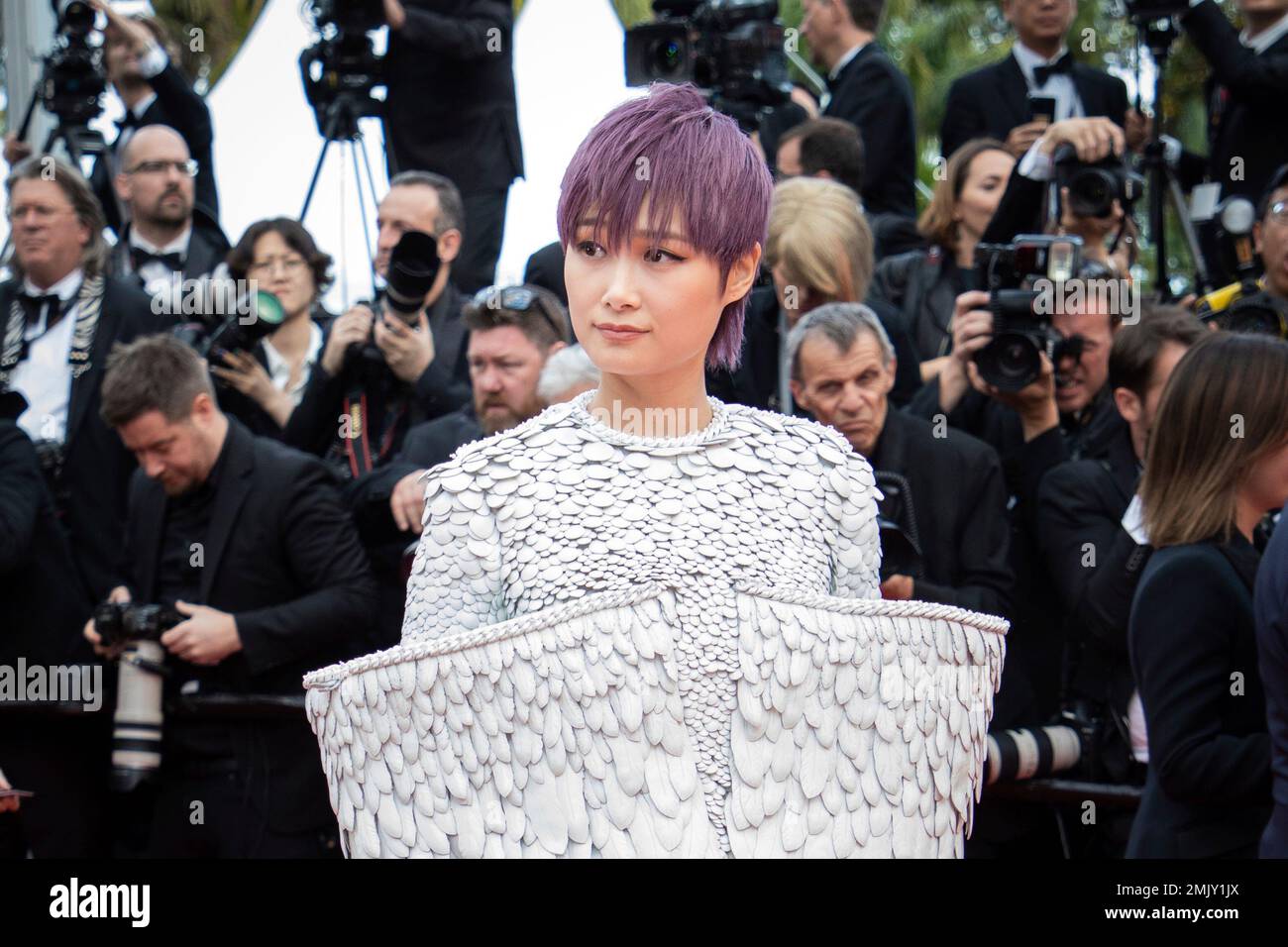Li Yuchun aka Chris Lee poses for photographers upon arrival at the ...