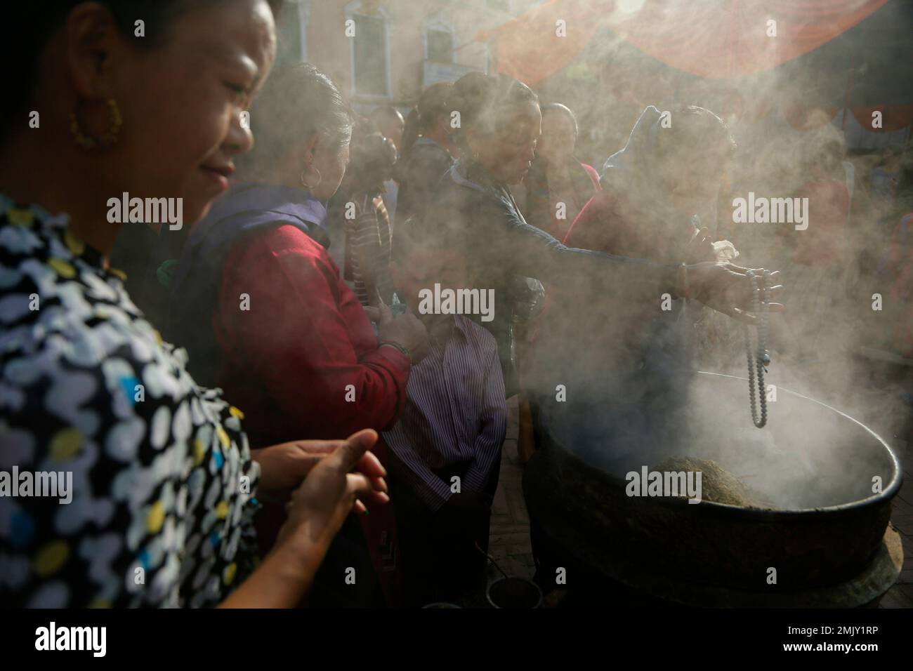 Nepalese devotees light incense sticks during Buddha Jayanti, or Buddha ...