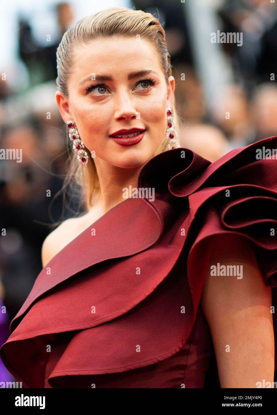 Actress Amber Heard poses for photographers upon arrival at the ...
