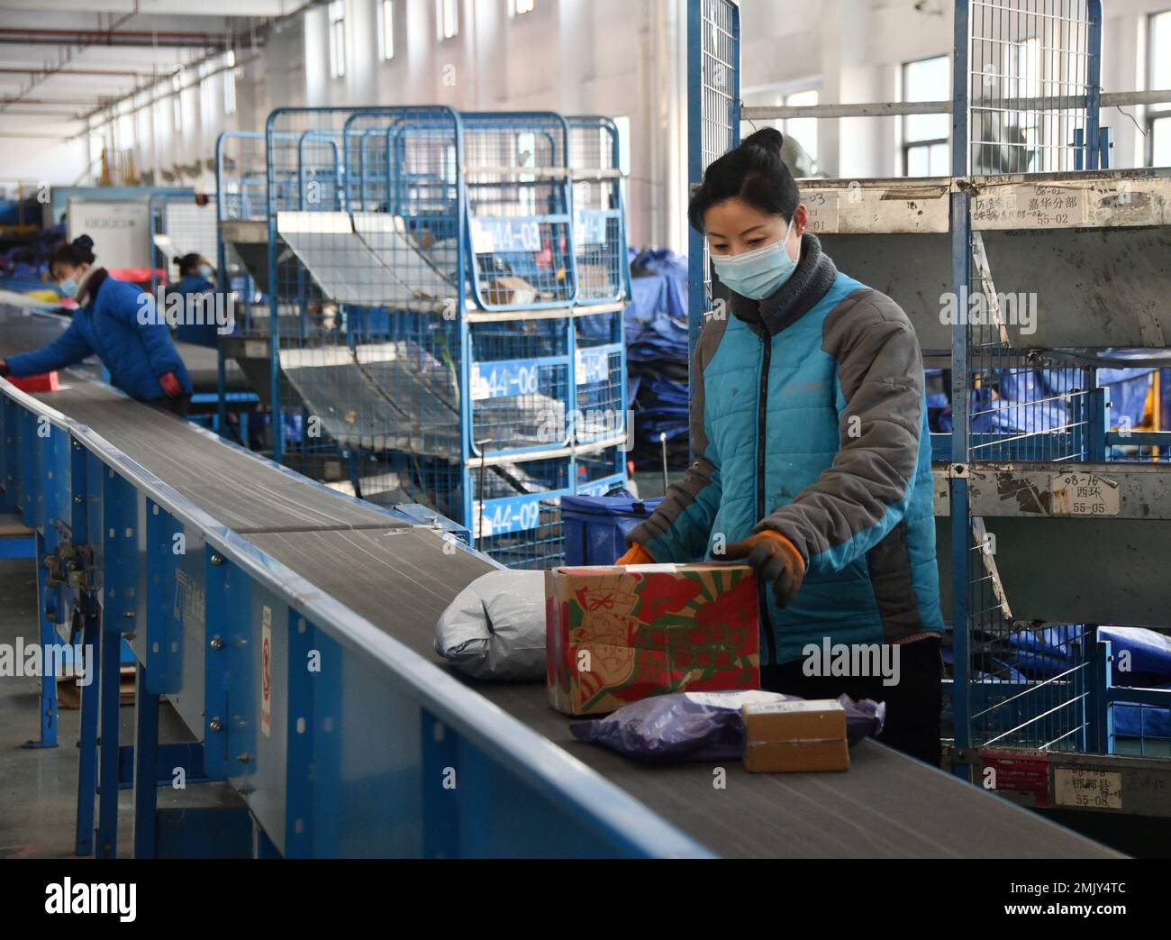 HANDAN, CHINA - JANUARY 21, 2023 - Workers sort express deliveries at ...