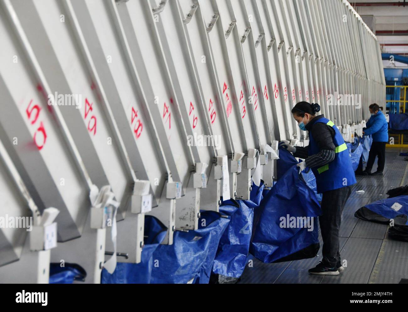 HANDAN, CHINA - JANUARY 21, 2023 - Workers sort express deliveries at ...