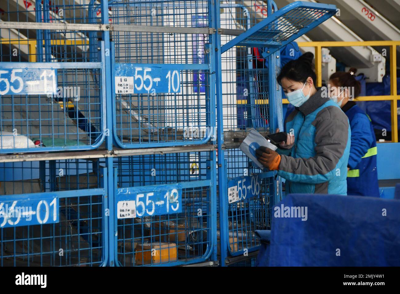 HANDAN, CHINA - JANUARY 21, 2023 - Workers sort express deliveries at ...