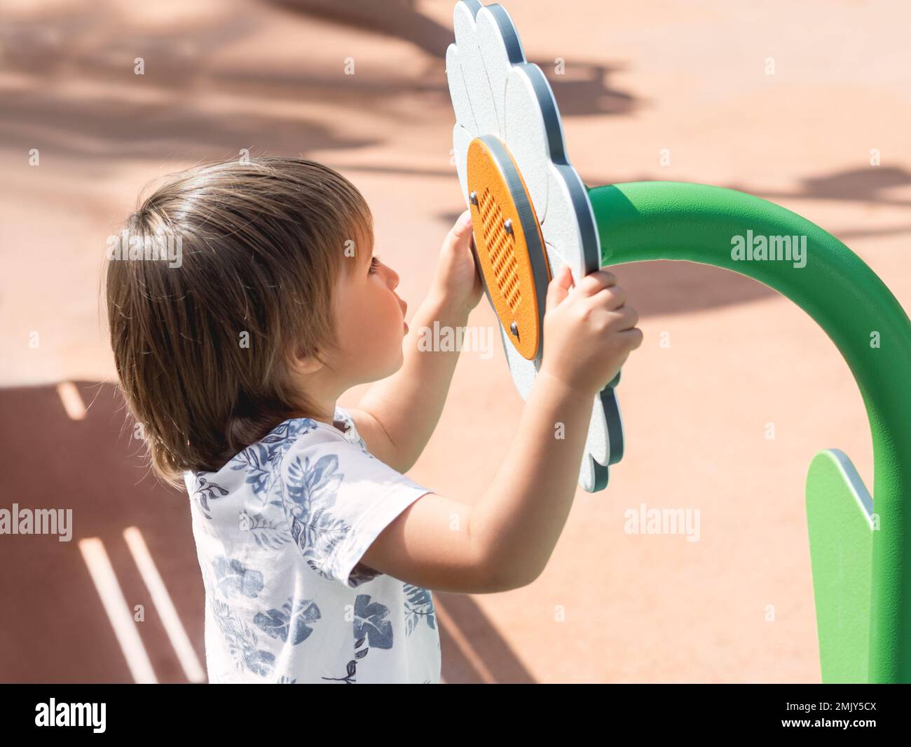 Little boy is playing on children outdoor playground. Toddler wants to ...
