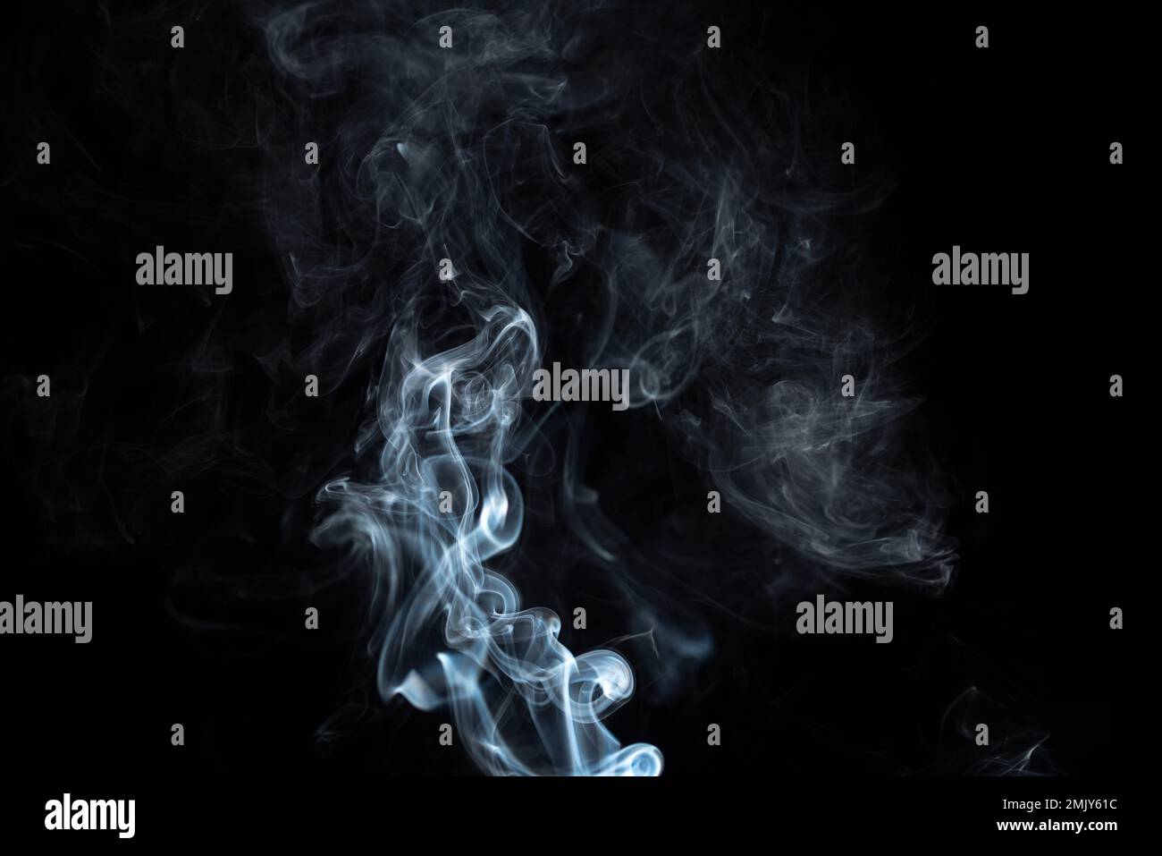 incense stick with white smoke against black background Stock Photo - Alamy