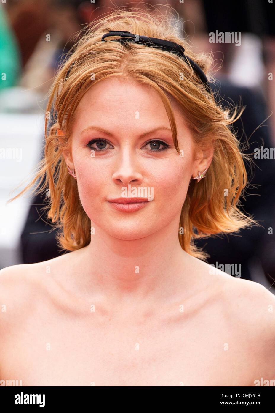 Actress Emily Beecham poses for photographers upon arrival at the ...