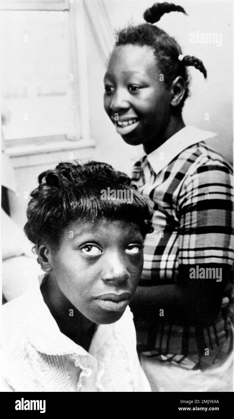 Minnie Lee Relf, 14, left, and her sister Mary Alice, 12, who have had ...