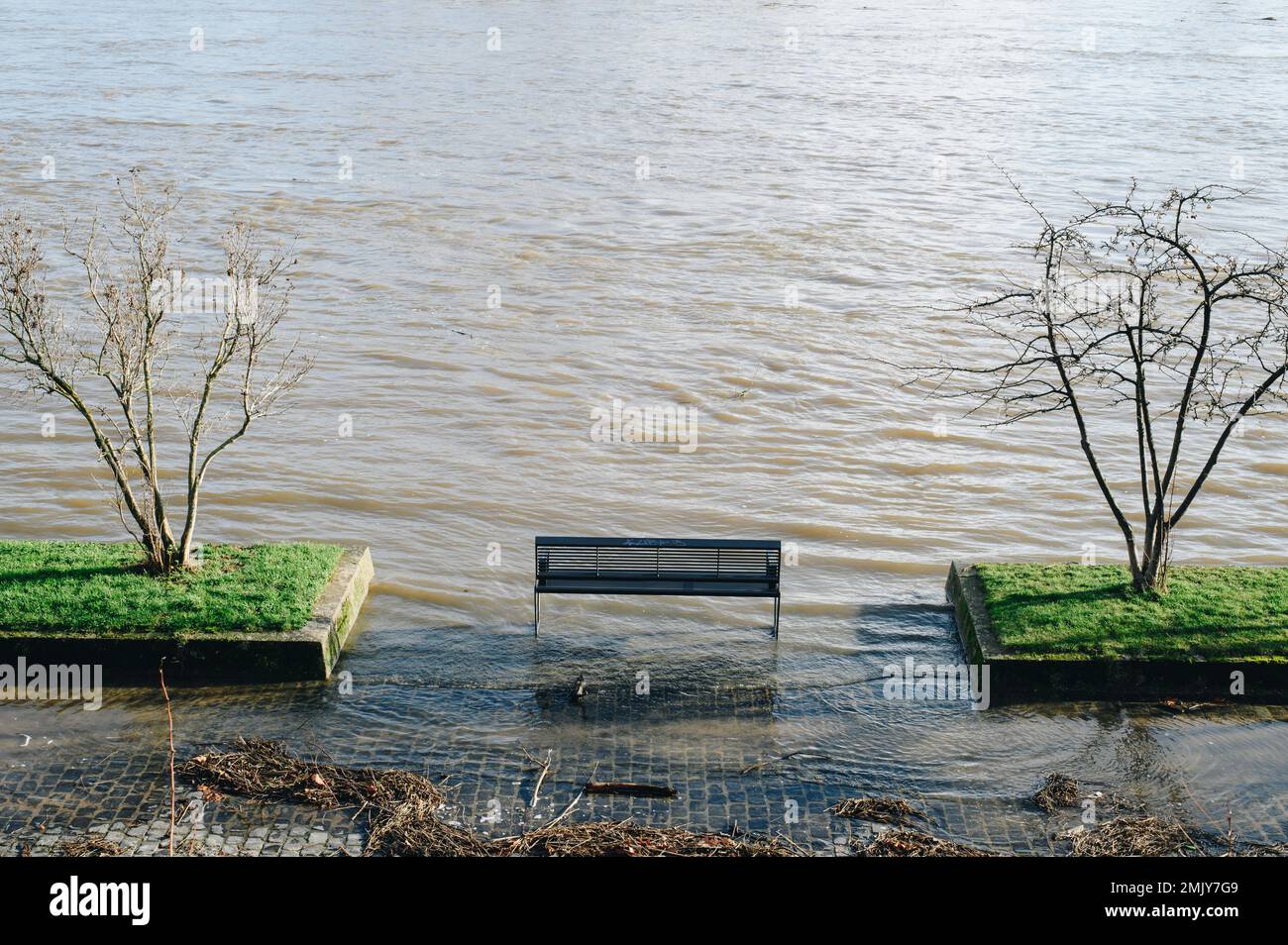 Bench in water. High water after heavy rainfall and snow melting in ...