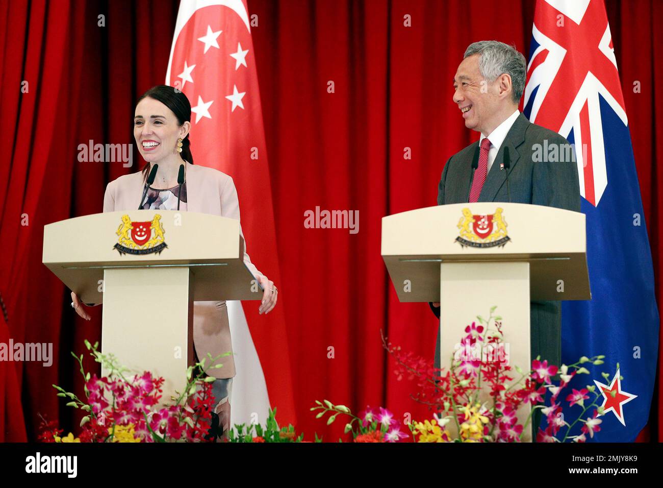 New Zealand's Prime Minister Jacinda Ardern, left, and Singapore's ...