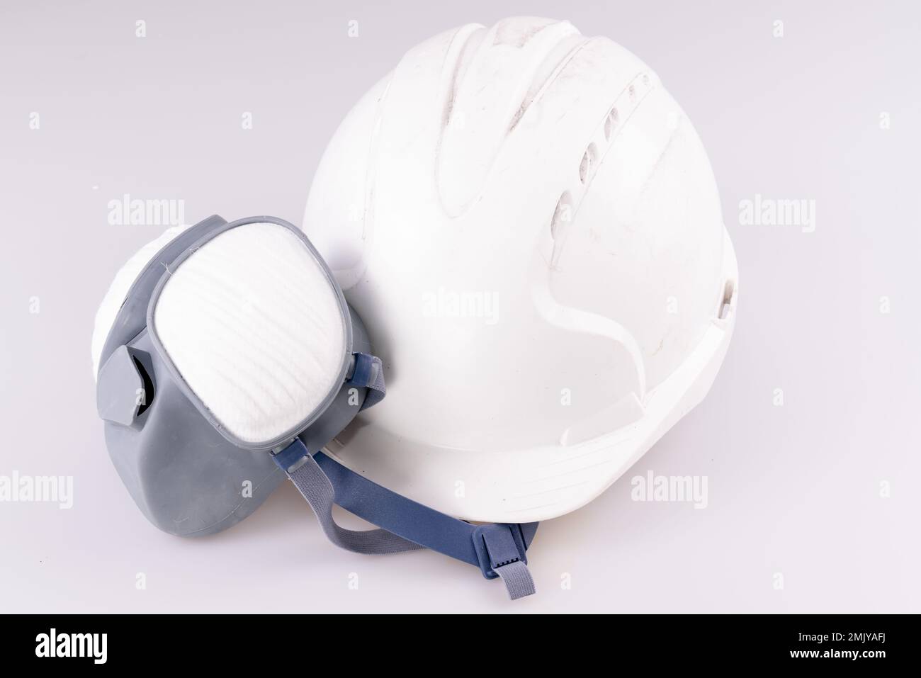 protective construction helmet and dust respirator Stock Photo - Alamy