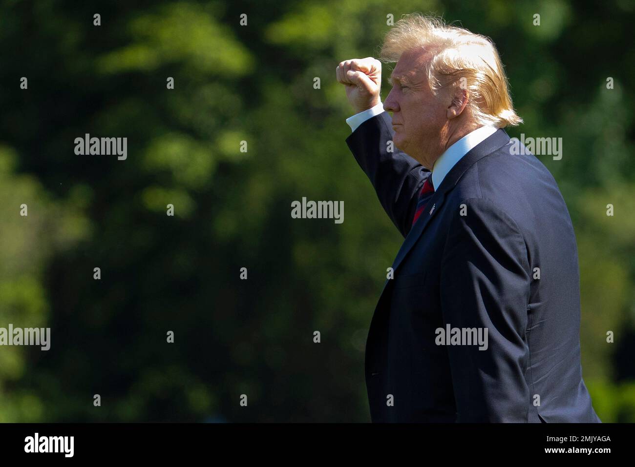 President Donald Trump walks on the South Lawn as he leaves White House ...
