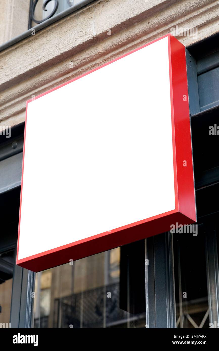 empty white red poster frame on store glass of showcase window of ...