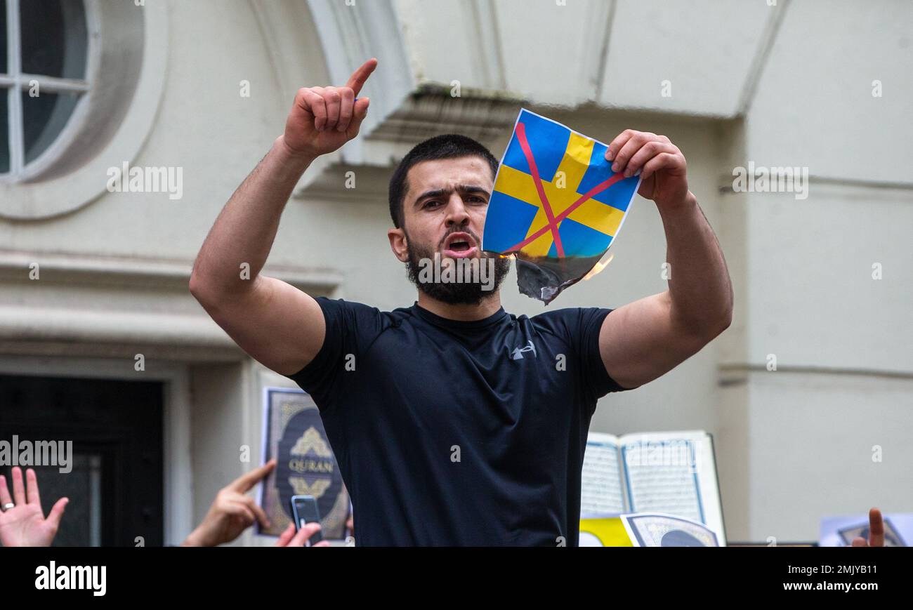 London, England, UK. 28th Jan, 2023. Muslim protesters burn Swedish ...