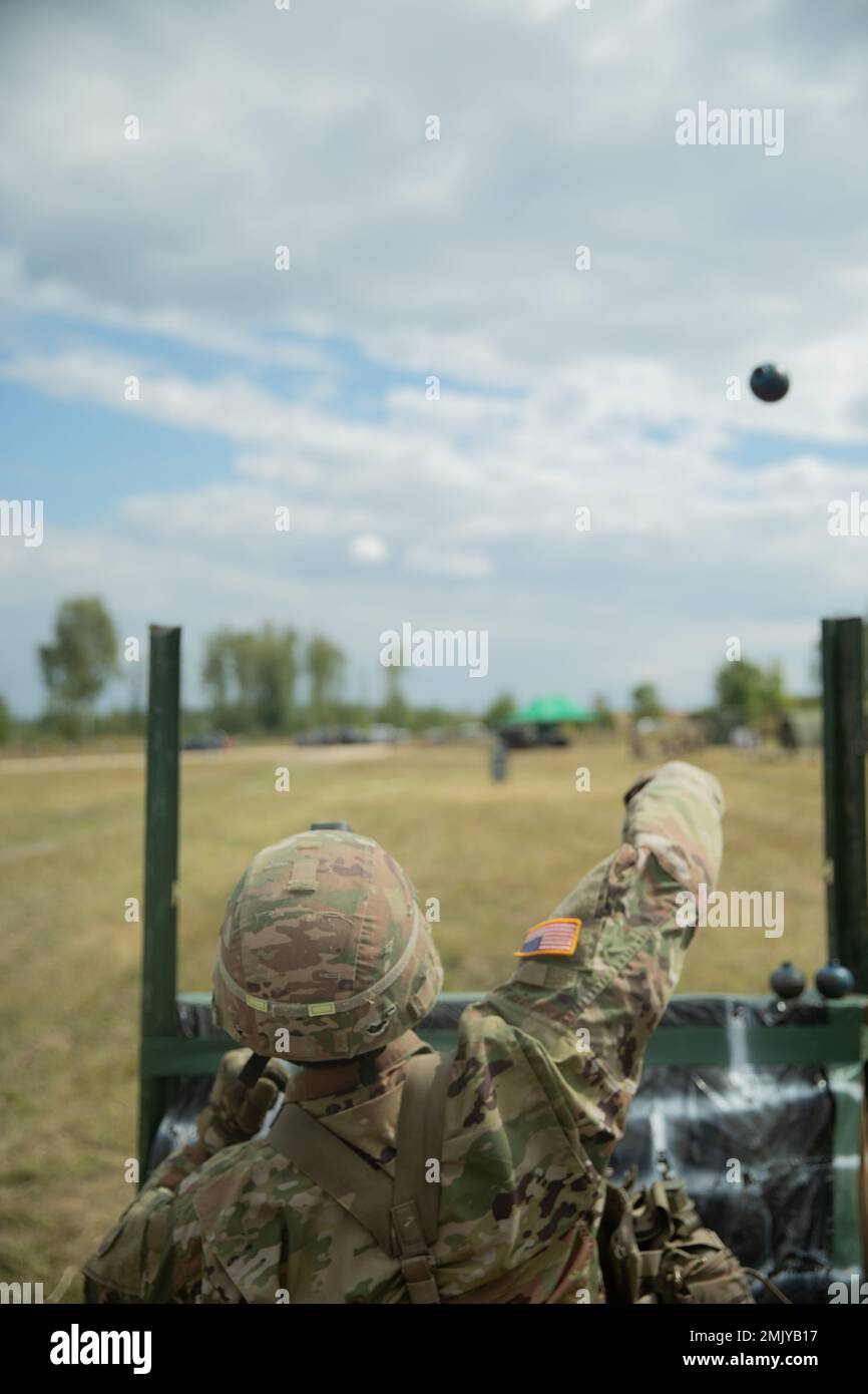 A U.S. Soldier throws the M67 grenade during the weapons lane, to earn ...