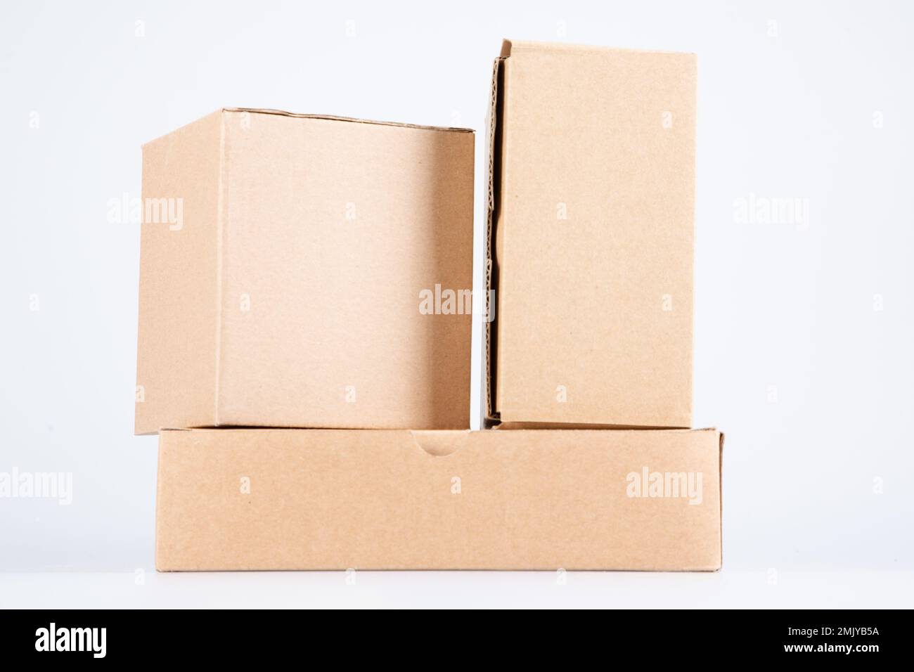 Cardboard Boxes three package isolated white background Stock Photo - Alamy