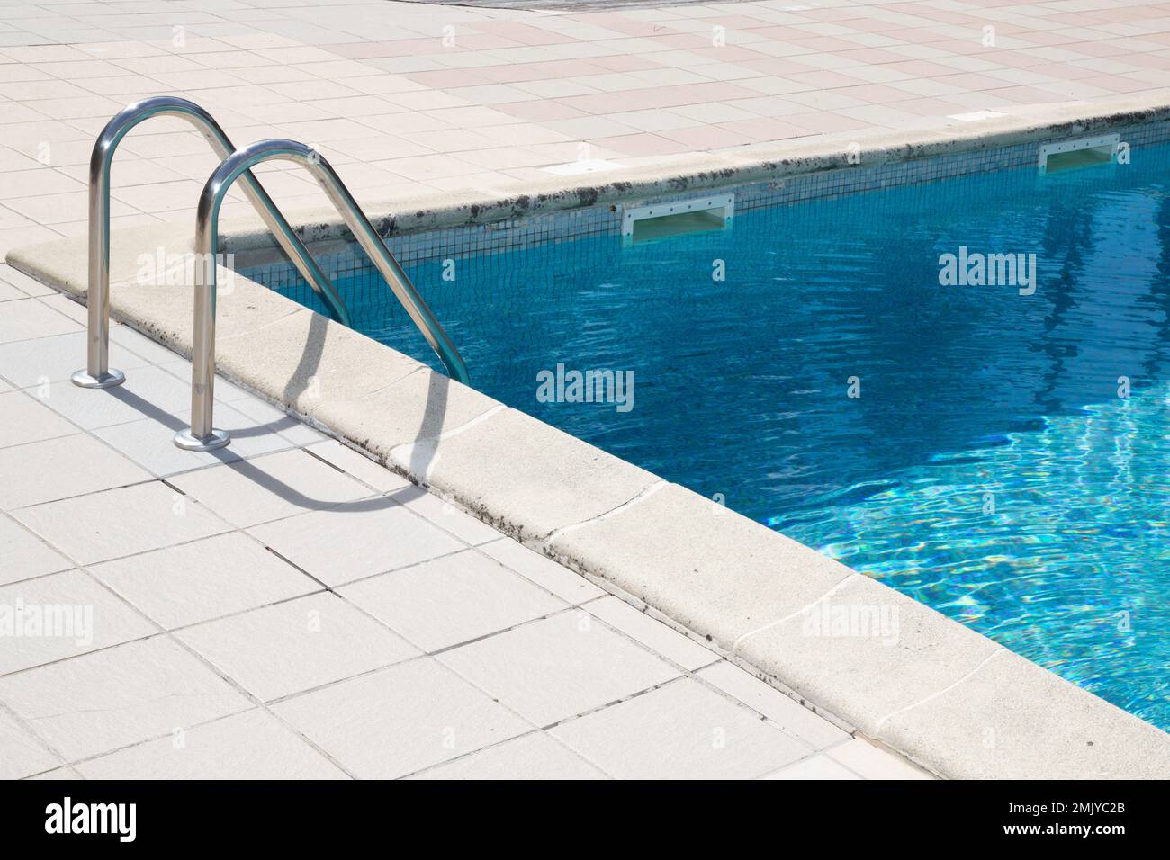 Metal staircase for entrance in swimming pool Stock Photo - Alamy