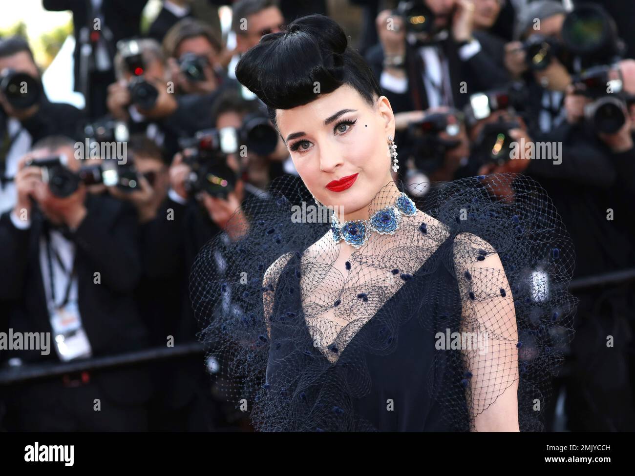 Burlesque dancer Dita Von Teese poses for photographers upon arrival at ...