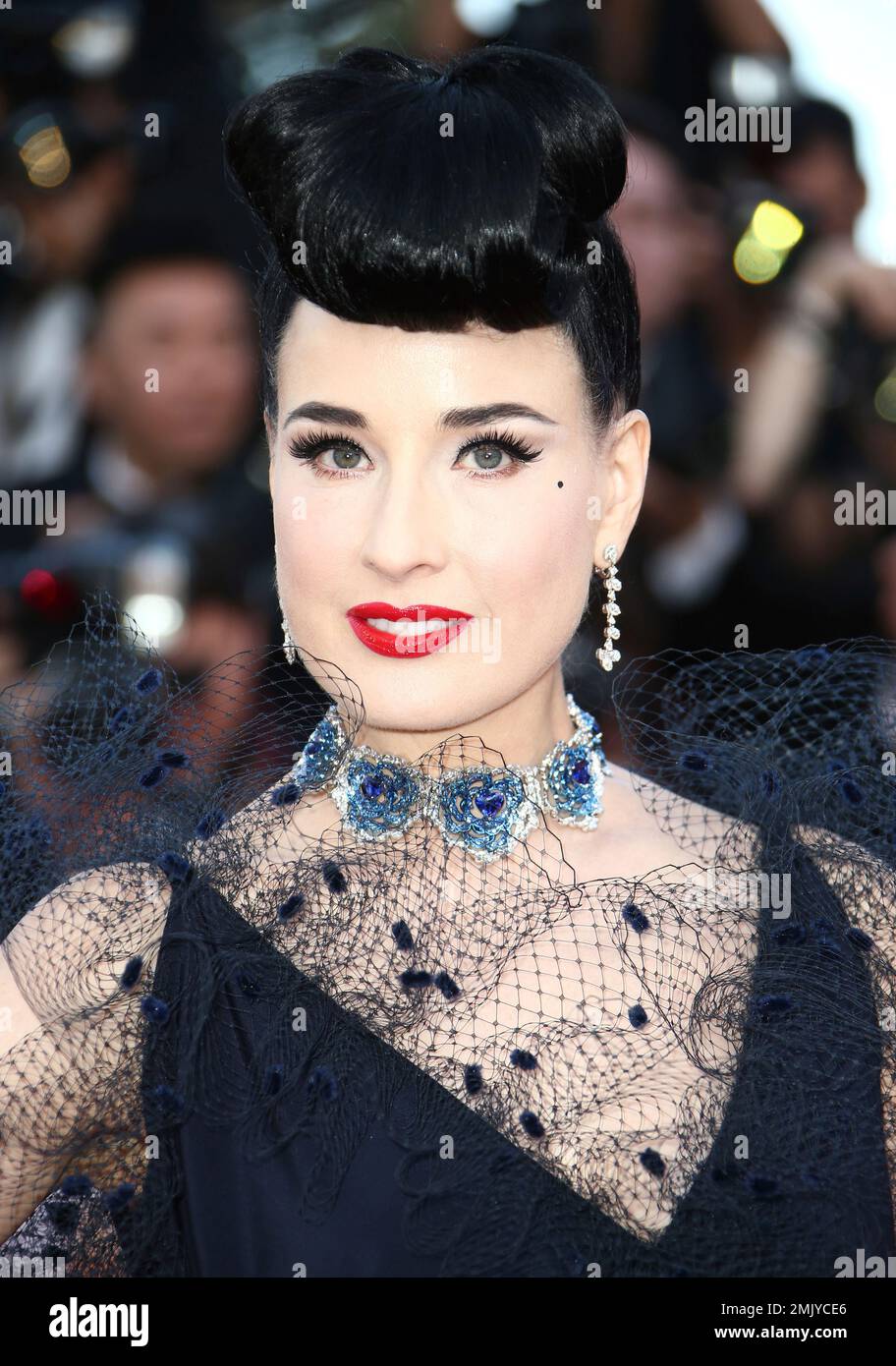 Burlesque dancer Dita Von Teese poses for photographers upon arrival at ...