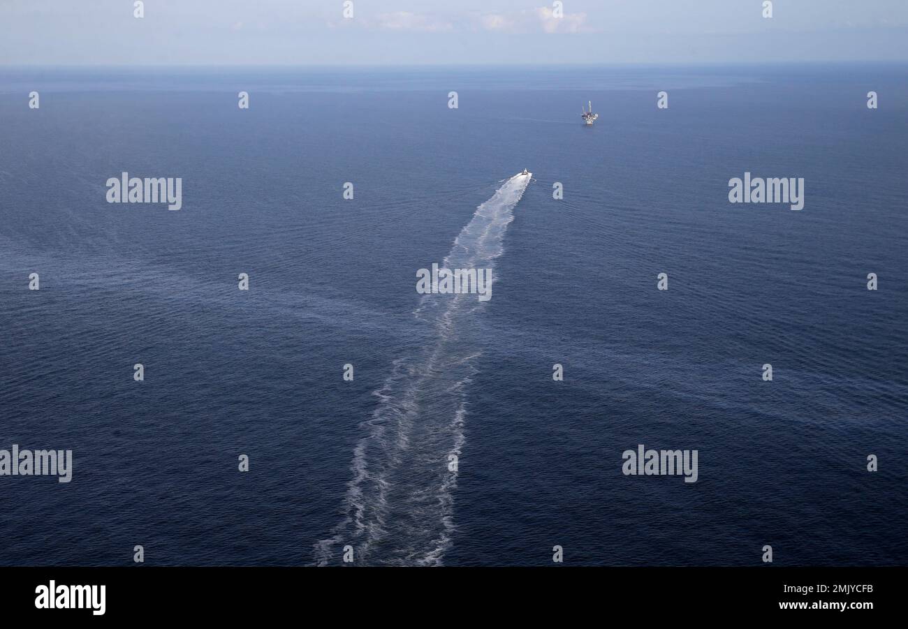 FILE - In this March 31, 2015 file photo, the wake of a supply vessel ...